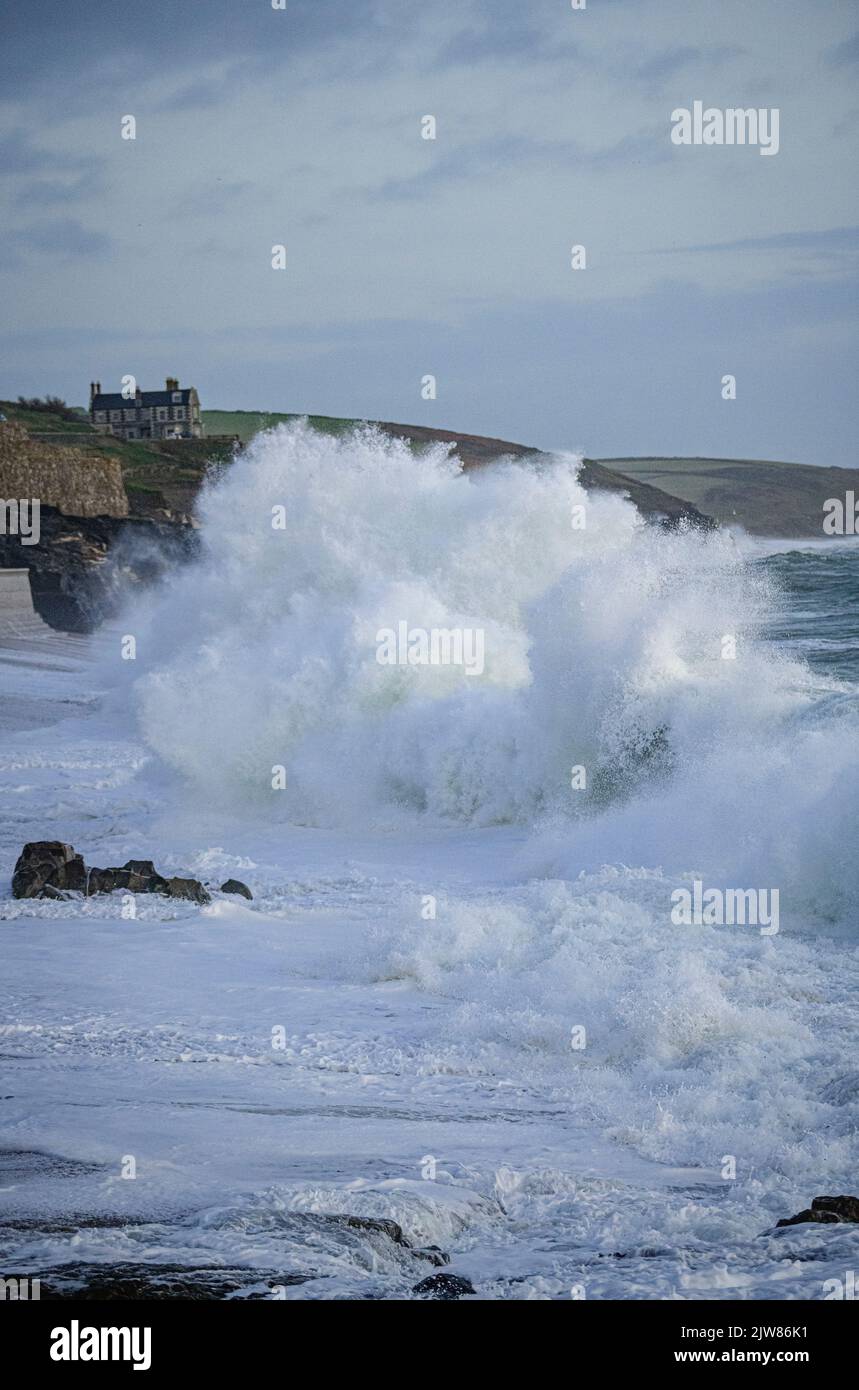 Massive waves pounding into Porthleven beach with Tye Rock Manor ...