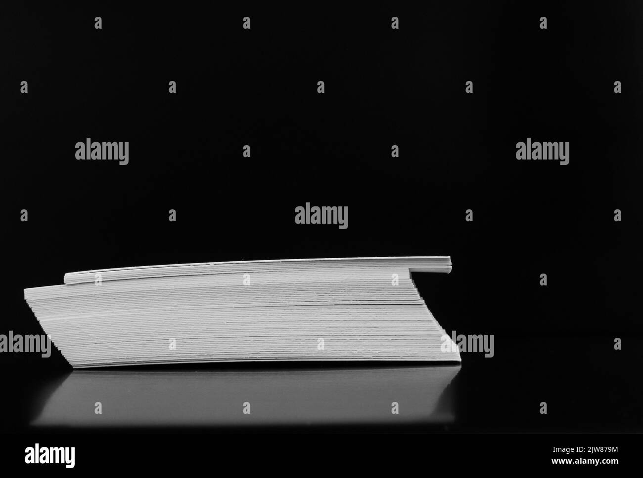 Stack of business cards close-up on black background. Side view. Black ...