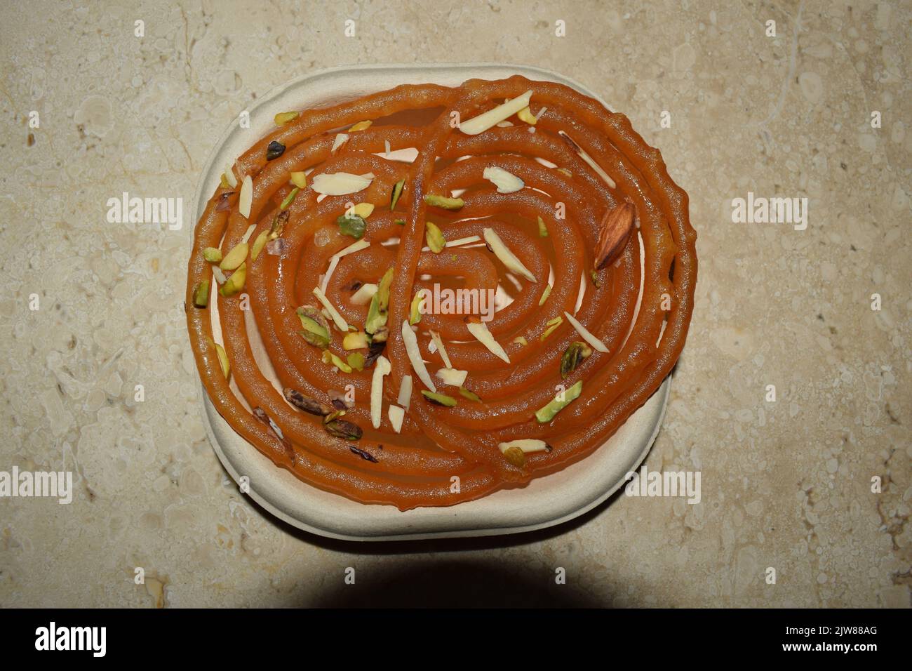 Tasty Jalebi Indian traditional sweets garnished with chopped dry ...