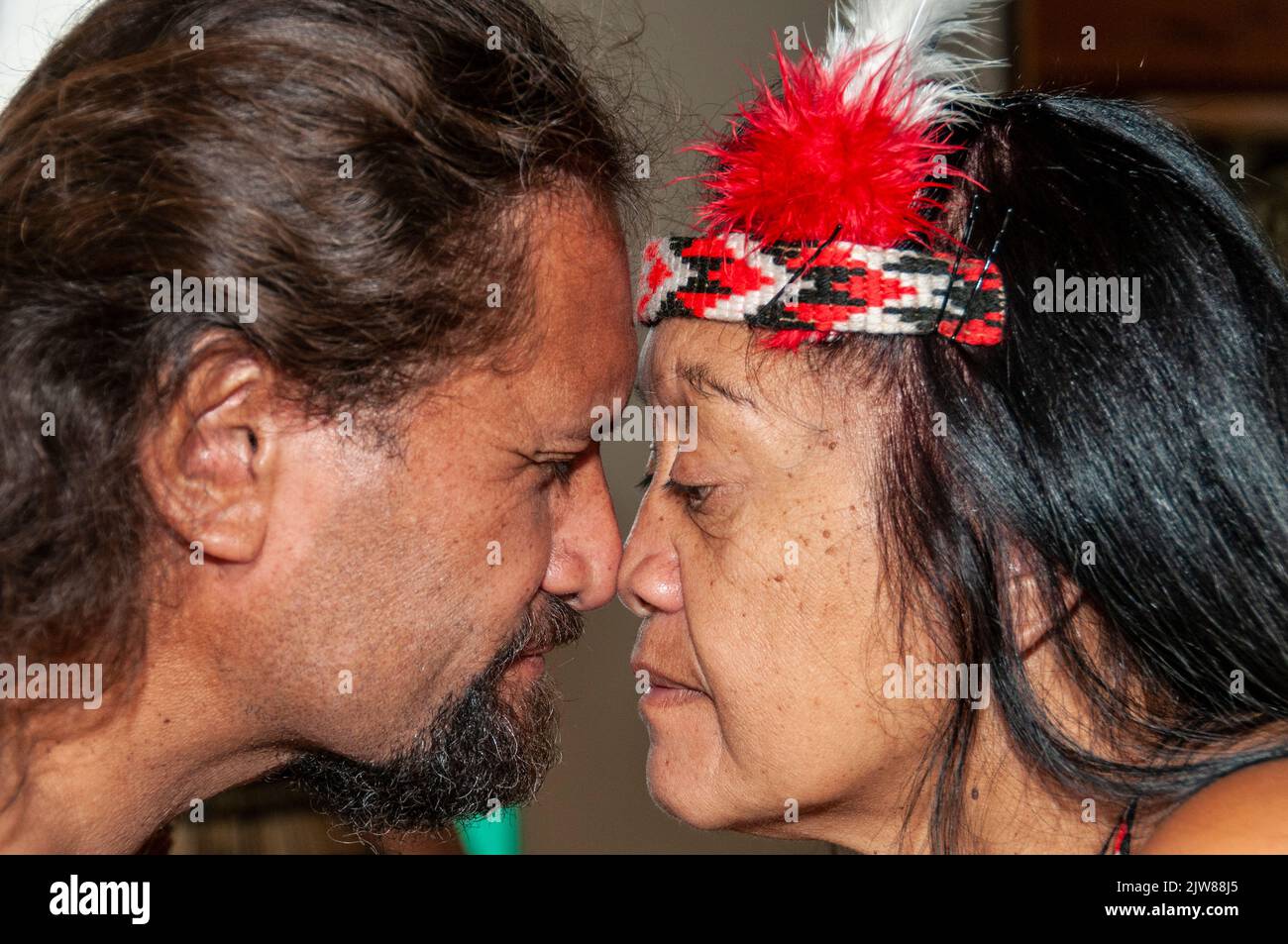 A couple of Maoris greet each other on the nose as a traditional ...