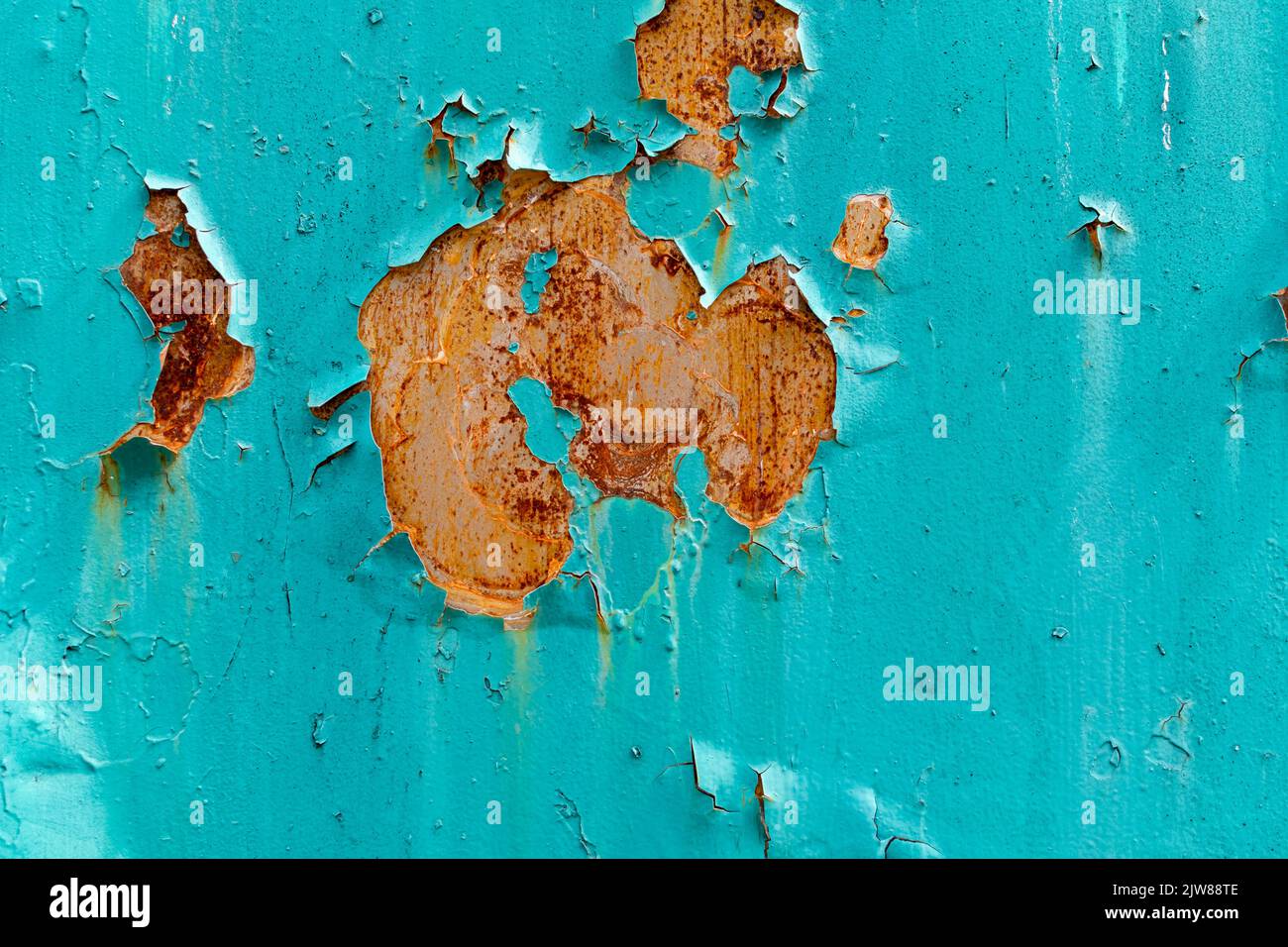 Brown rust with peeling blue paint on old metal fence Stock Photo - Alamy