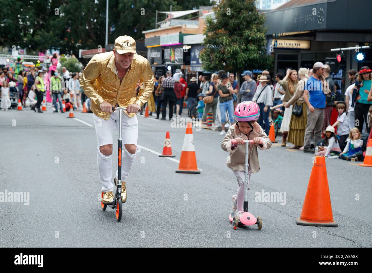 Children and adults take part in races with their bicycles, scooters ...