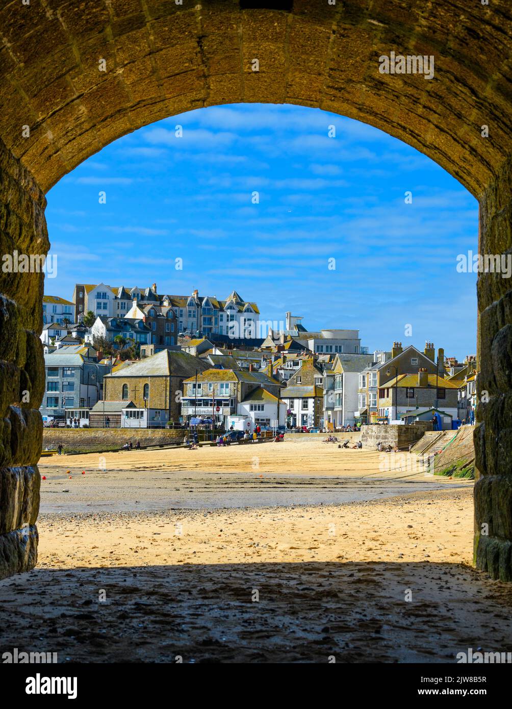 Looking through the old pier tunnels at the Cornish cottages that over ...