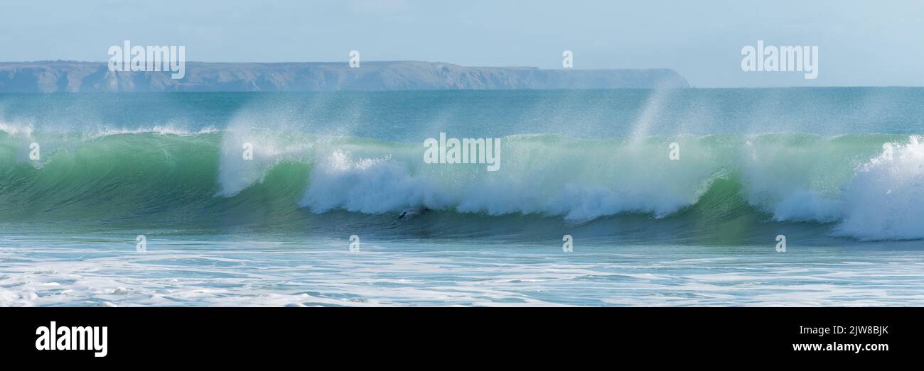 Stunning long wave rolling into Praa Sands Cornwall's beach Stock Photo ...