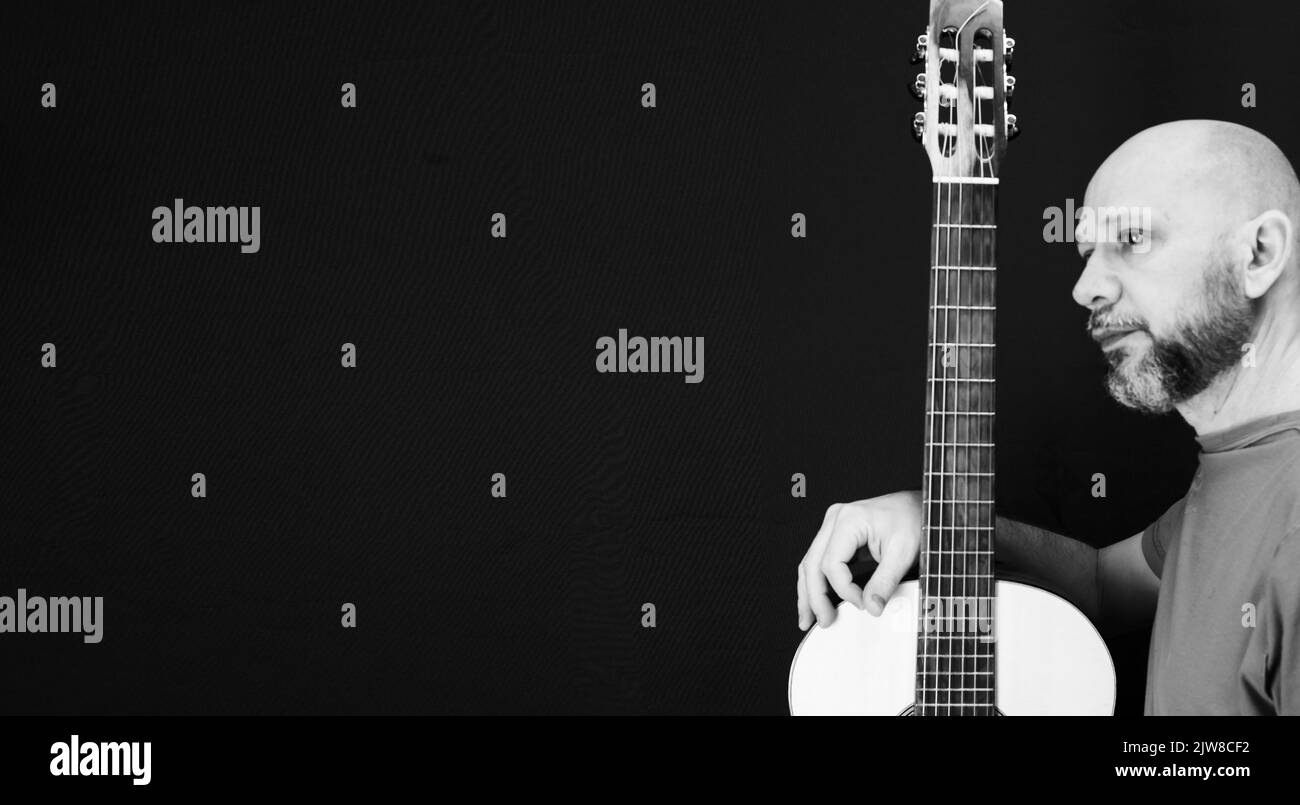 Black and white portrait. String musical instrument. Mature charismatic ...