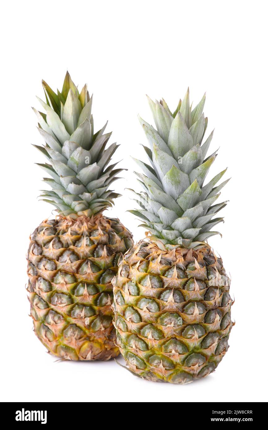 Two pineapples isolated on white background Stock Photo - Alamy