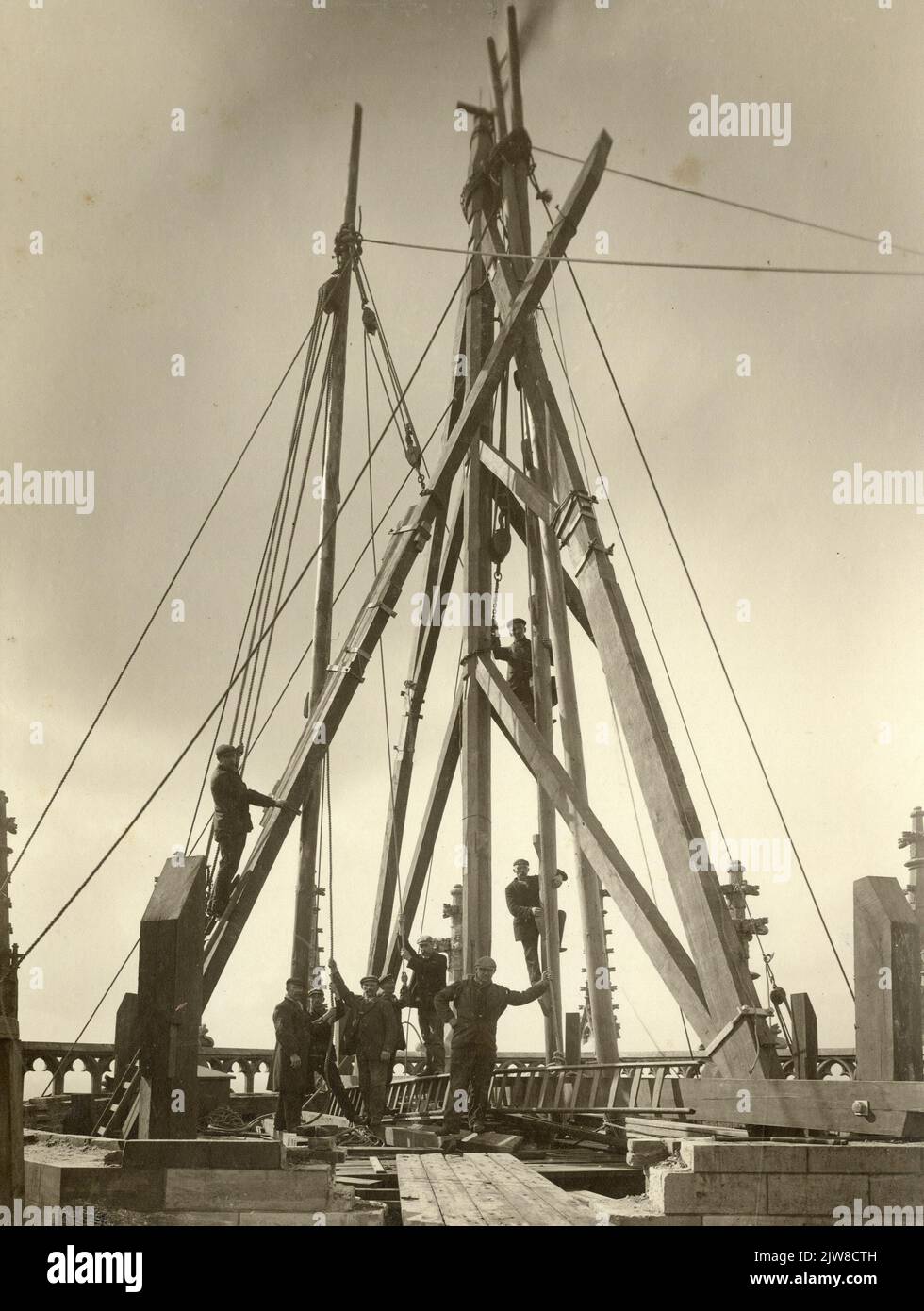 Image of the workmen in the construction of the new hood of the lantern ...