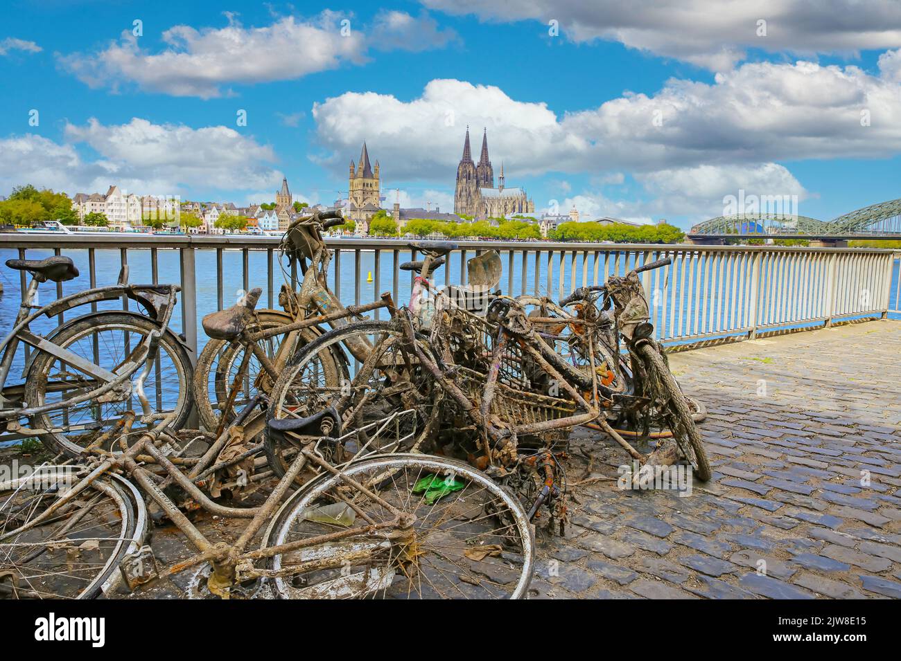 Cologne, Germany - July 9. 2022: Pile many old muddy rusty bicycles ...