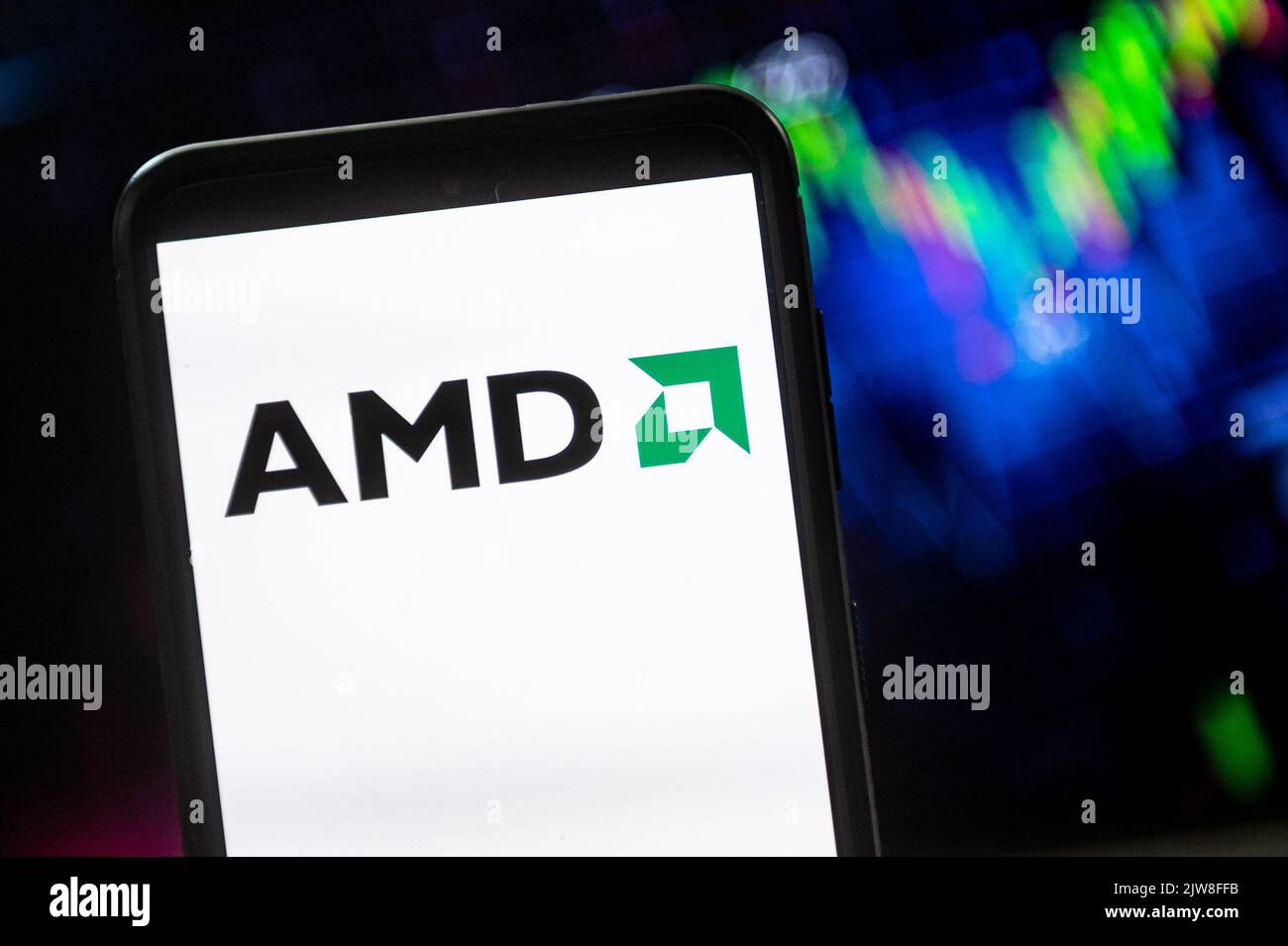 In this photo illustration a AMD logo seen displayed on a smartphone ...