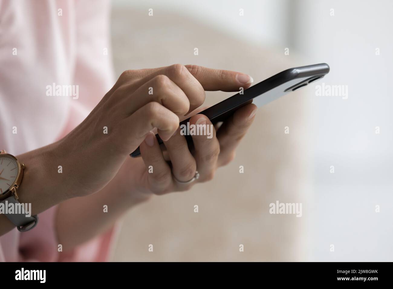 Smartphone user woman touching screen, typing, using online app Stock ...
