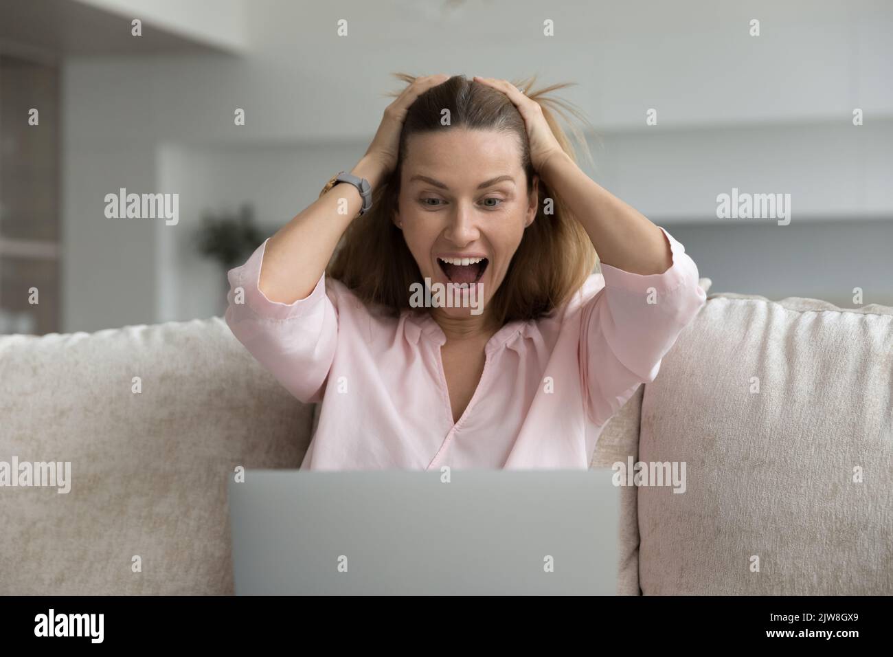 Excited woman computer home hi-res stock photography and images - Alamy