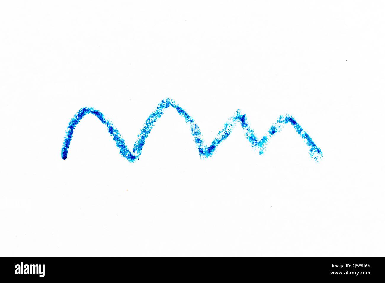Blue color crayon hand drawing in zigzag line shape on white paper ...