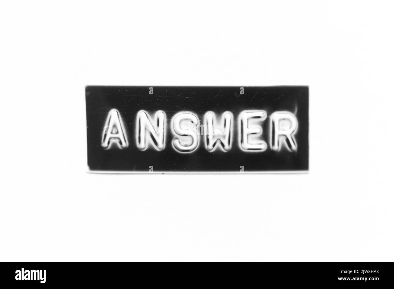 Black color banner that have embossed letter with word answer on white ...