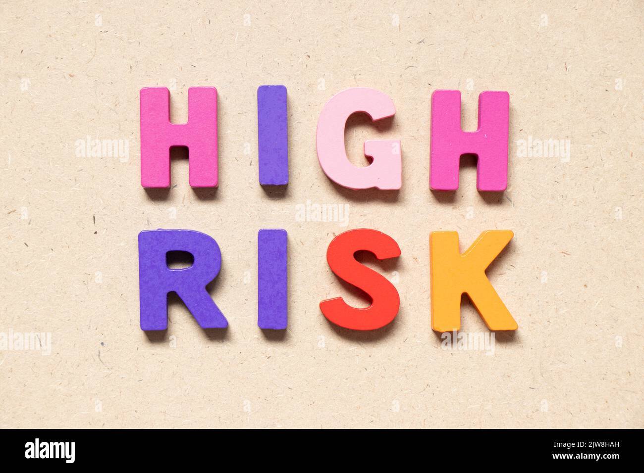 Color alphabet letter in word high risk on wood background Stock Photo ...
