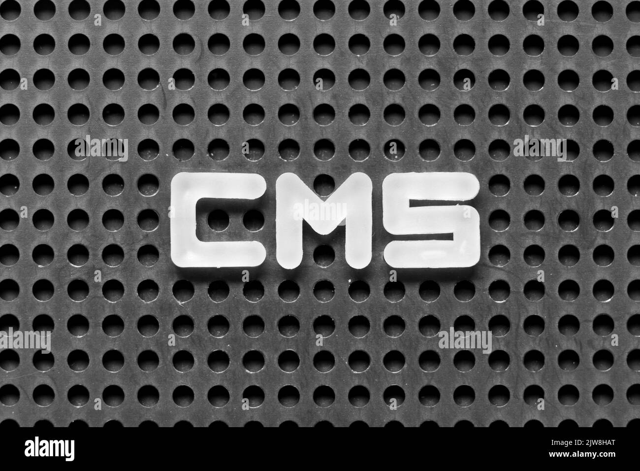 White alphabet letter in word CMS (Abbreviation of Content management ...
