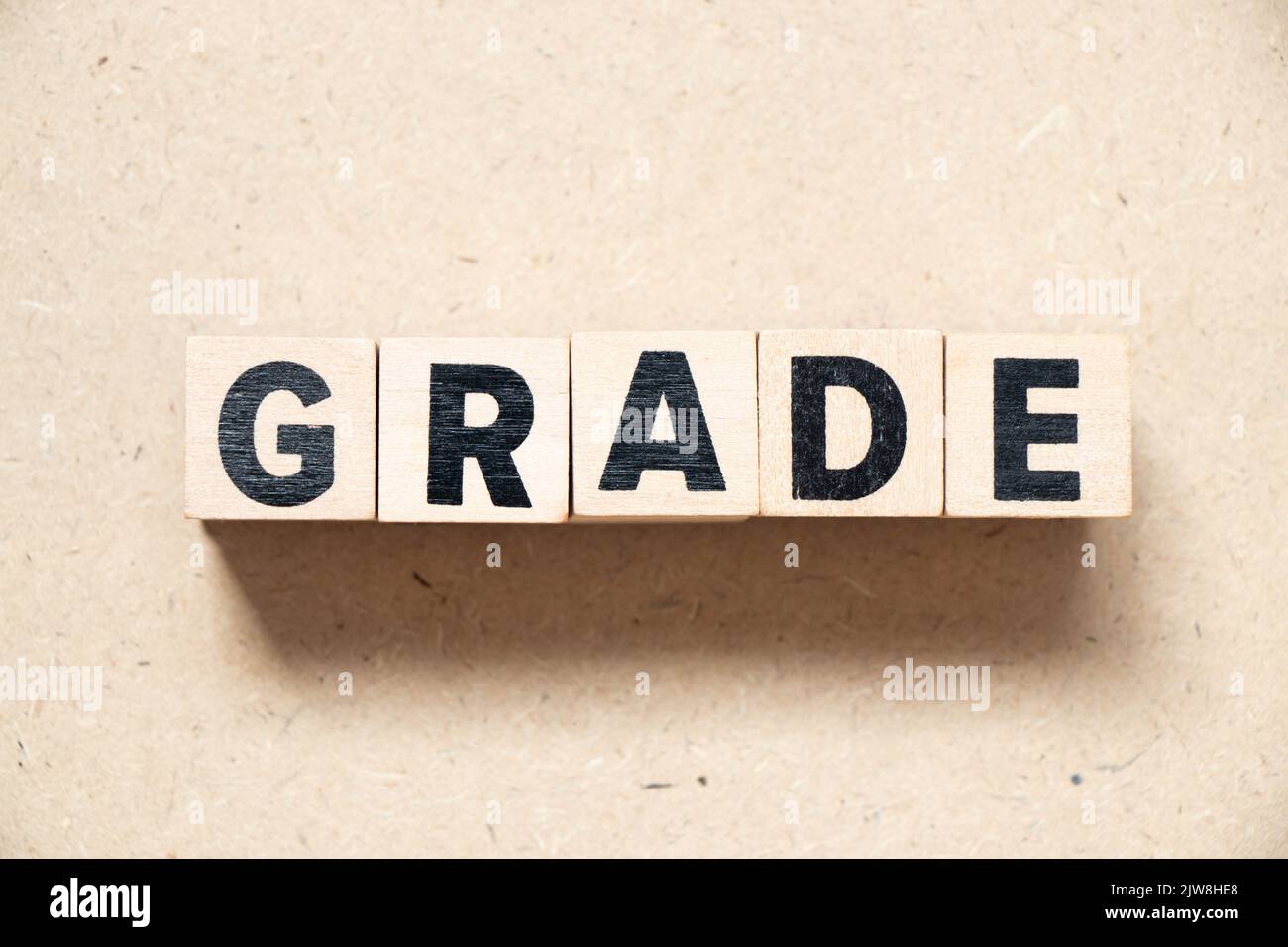 Alphabet letter block in word grade on wood background Stock Photo - Alamy
