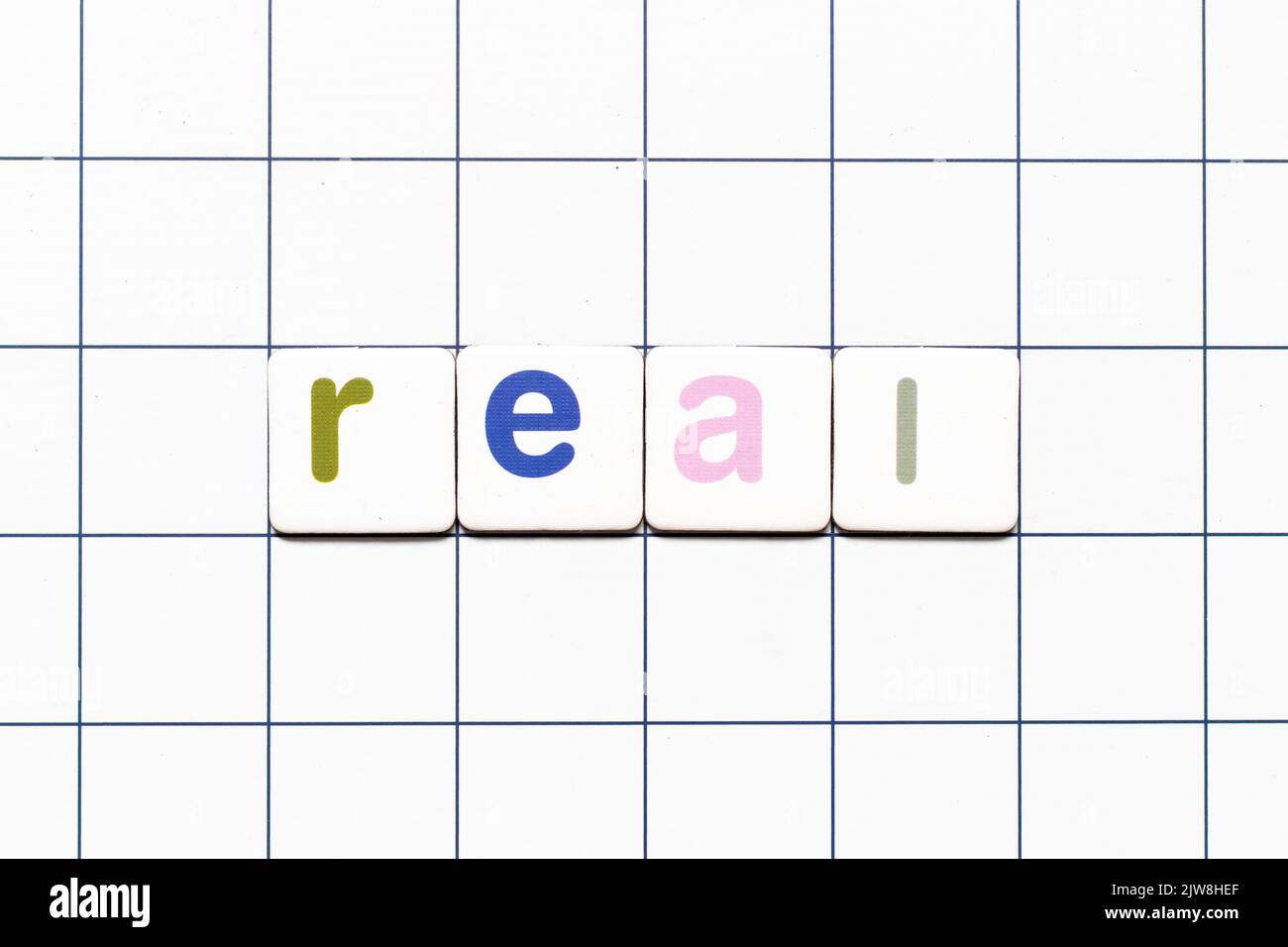 Colorful tile letter in word real on white grid background Stock Photo ...