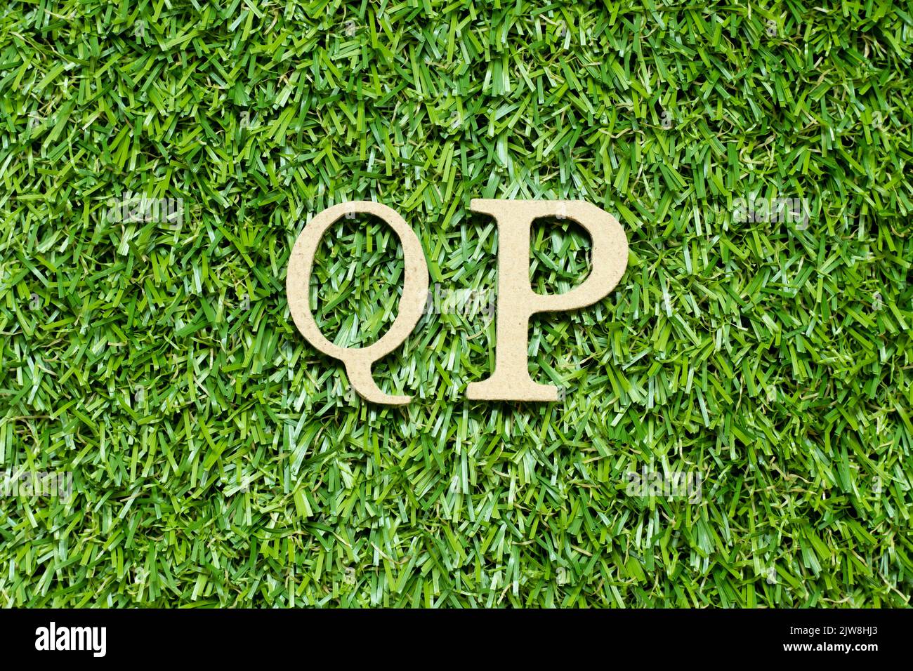 Wood alphabet letter in word QP (Abbreviation of Quality procedure) on ...
