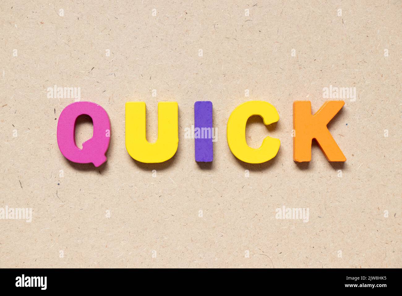 Color alphabet letter in word quick on wood background Stock Photo - Alamy