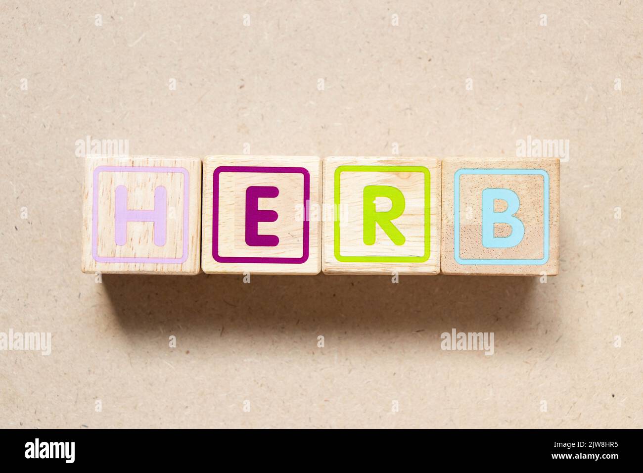 Color letter block in word herb on wood background Stock Photo - Alamy