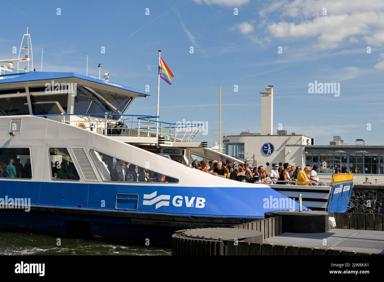 Amsterdam, Netherlands - August 2022: River ferry arriving at the ...