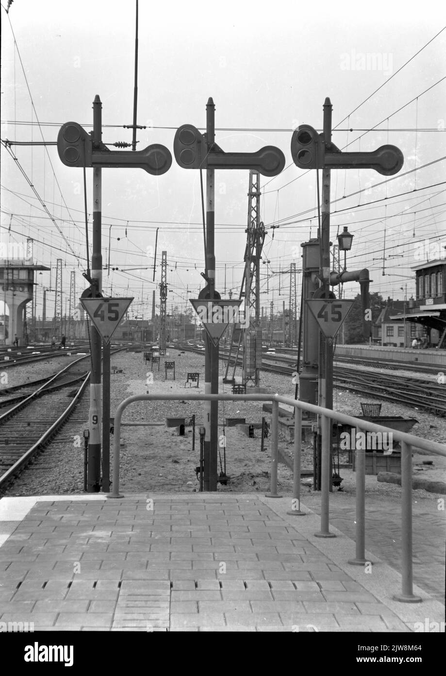Image of three mechanically operated main signals with speed limit ...
