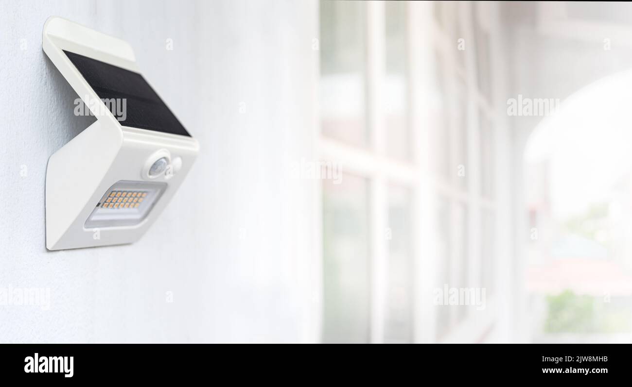 Small solar powered led light with motion sensor Stock Photo - Alamy