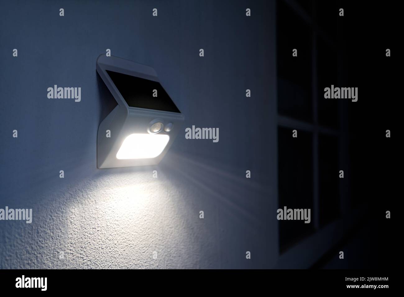Small solar powered led light with motion sensor Stock Photo - Alamy