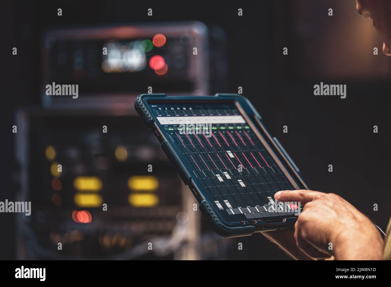 Remote control and sound settings from the tablet Stock Photo - Alamy