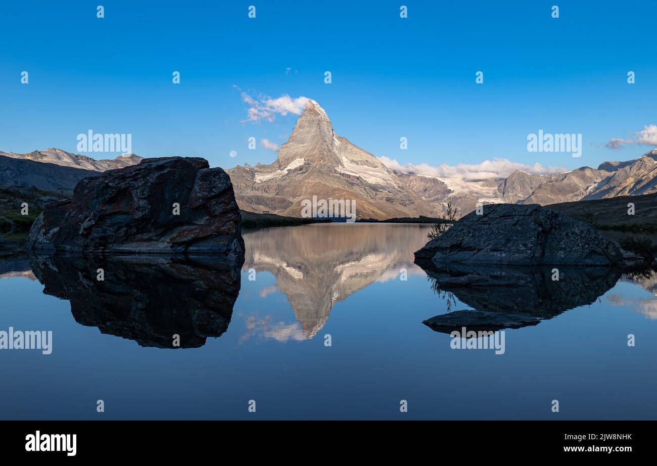 Matterhorn reflection in Stelisee, sunny morning Stock Photo - Alamy