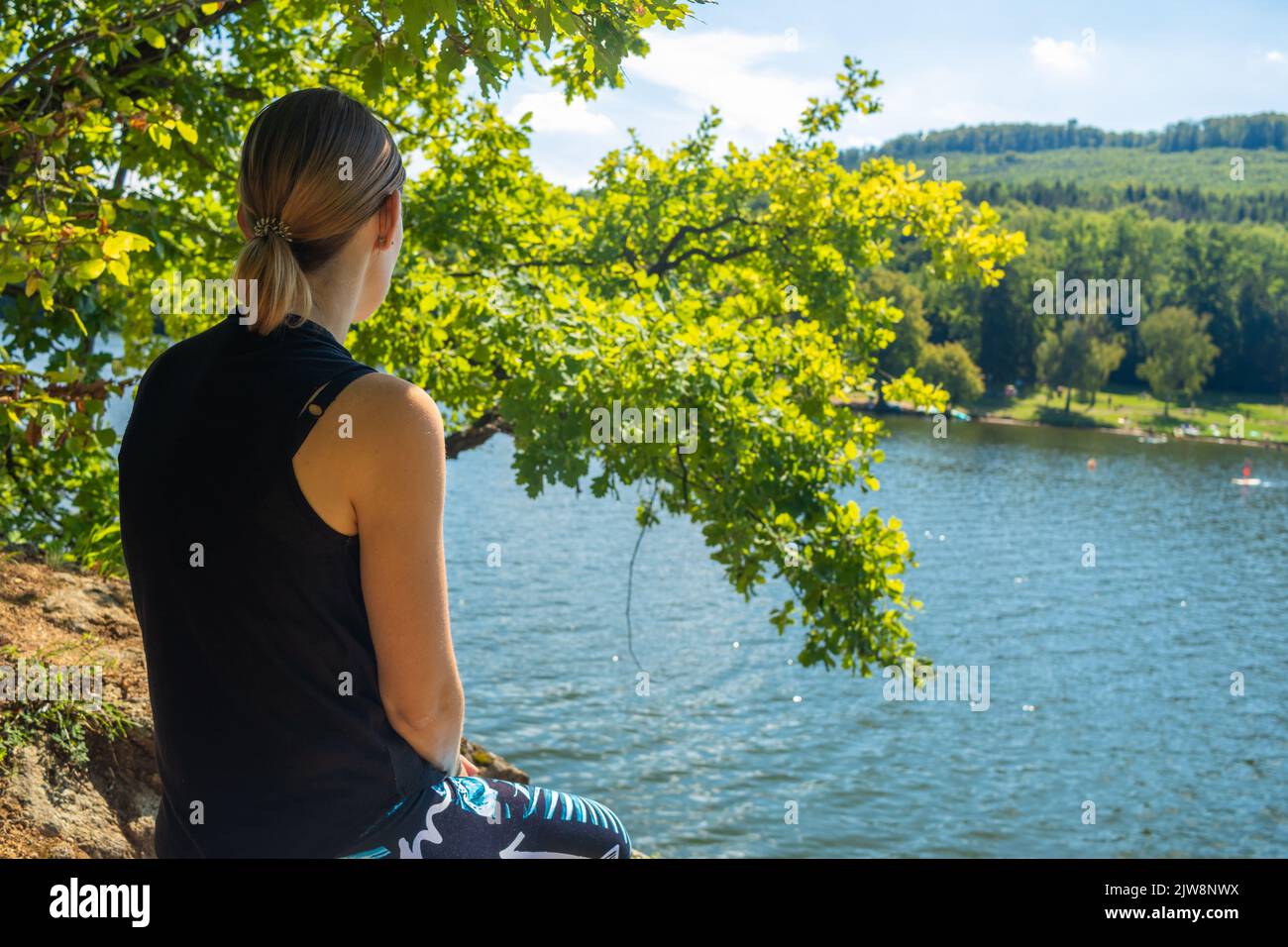 Woman from behind sitting hi-res stock photography and images - Alamy