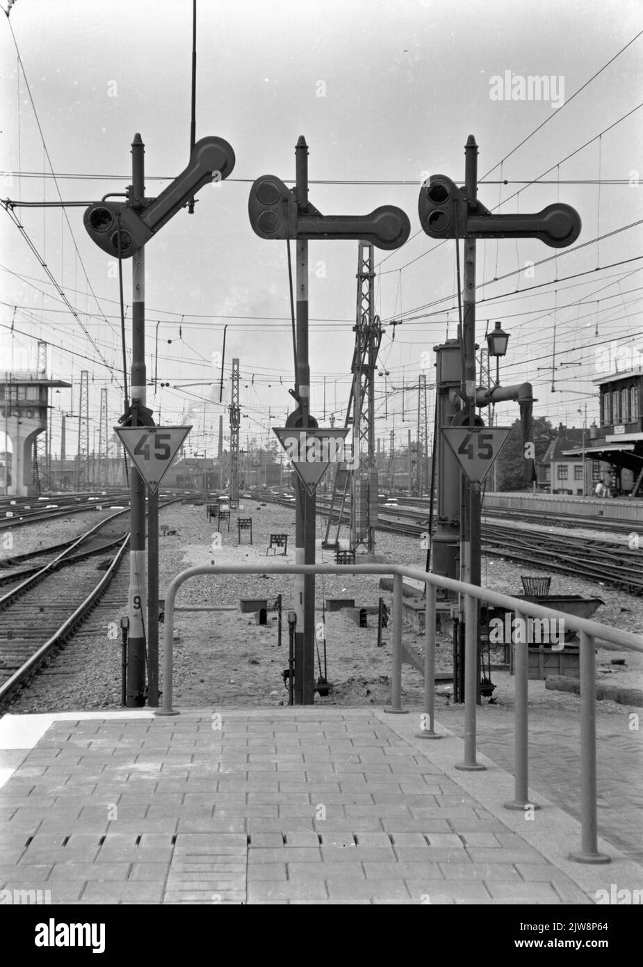 Image of three mechanically operated main signals with speed limit ...