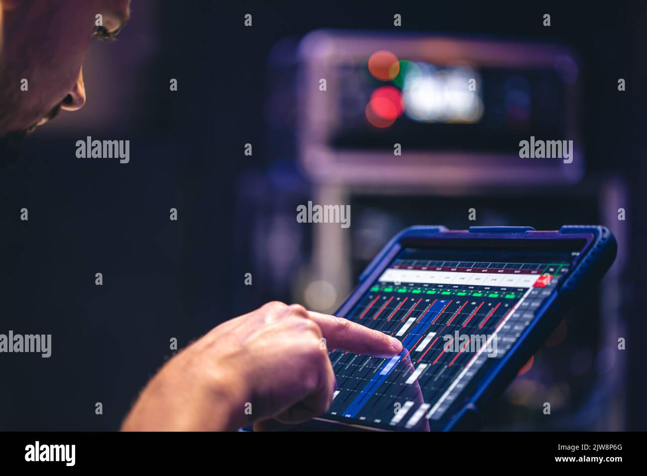 Remote control and sound settings from the tablet Stock Photo - Alamy