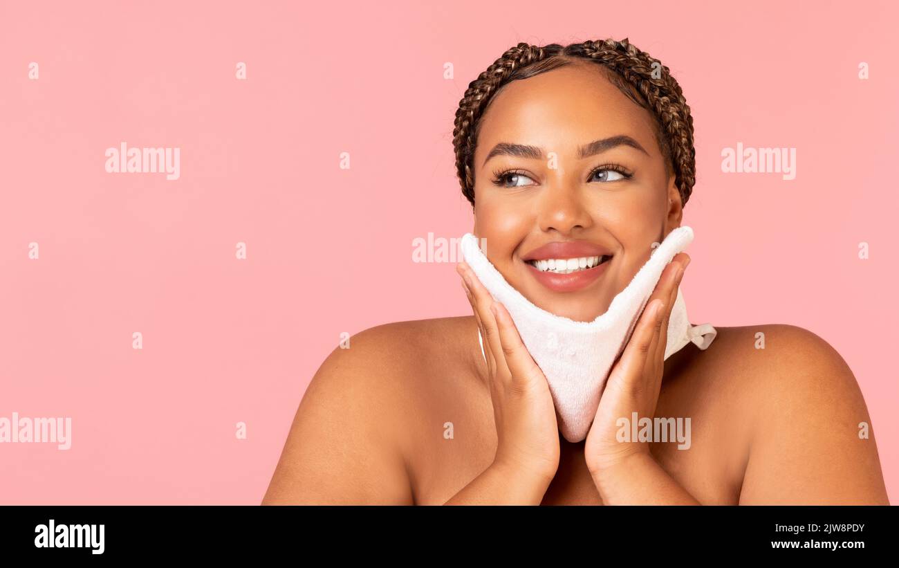 African Female Caring For Skin Drying Face With Towel, Studio Stock ...