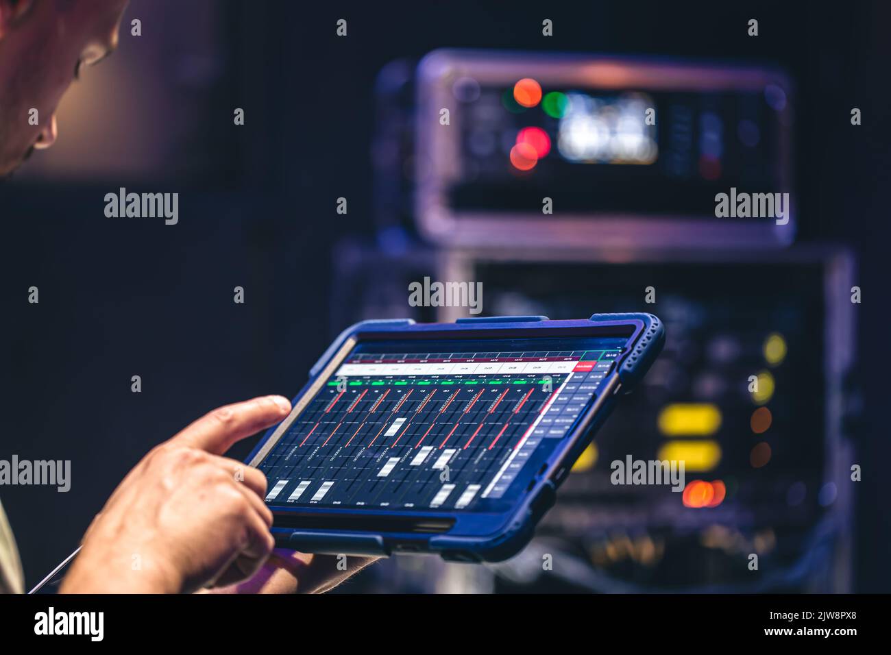 Remote control and sound settings from the tablet Stock Photo - Alamy