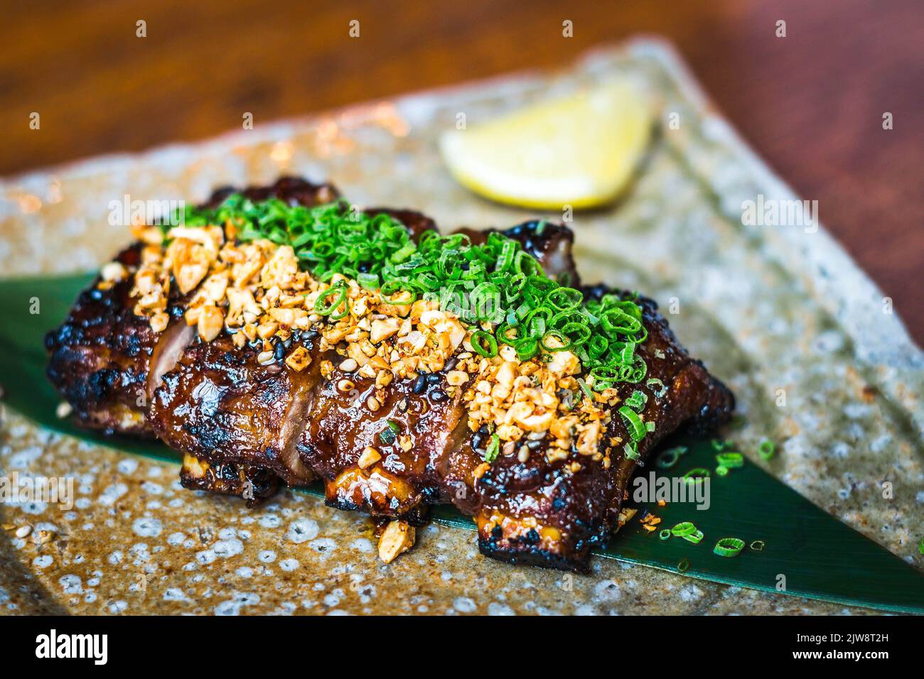 BBQ beef ribs with glazing and peanuts and chopped spring onions Stock ...