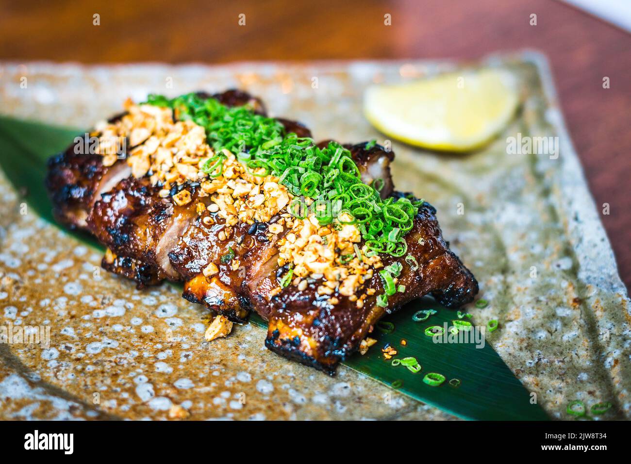 BBQ beef ribs with glazing and peanuts and chopped spring onions Stock ...