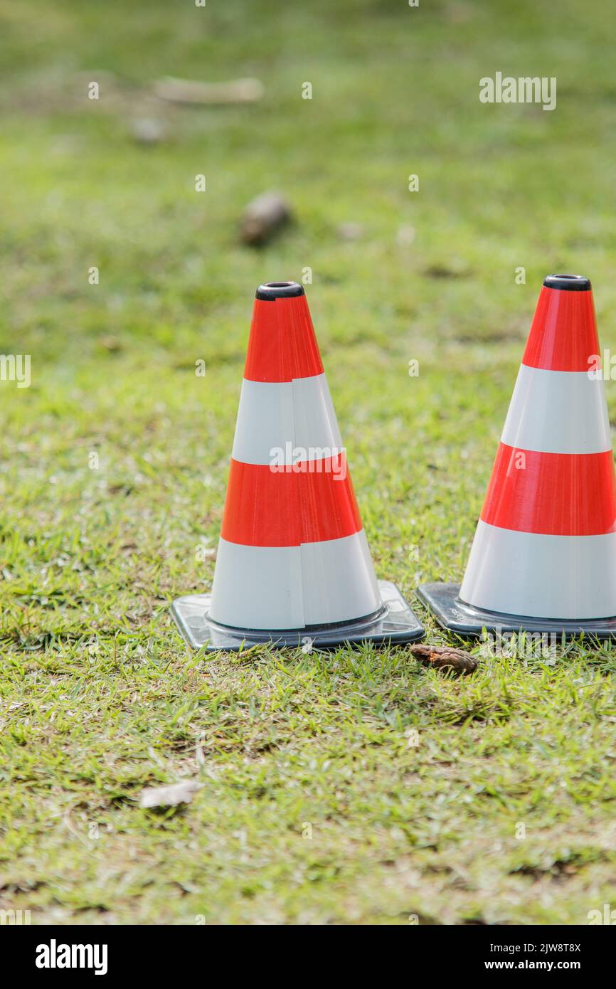 orange and white traffic light cone on a lawn in Rio de Janeiro Stock ...