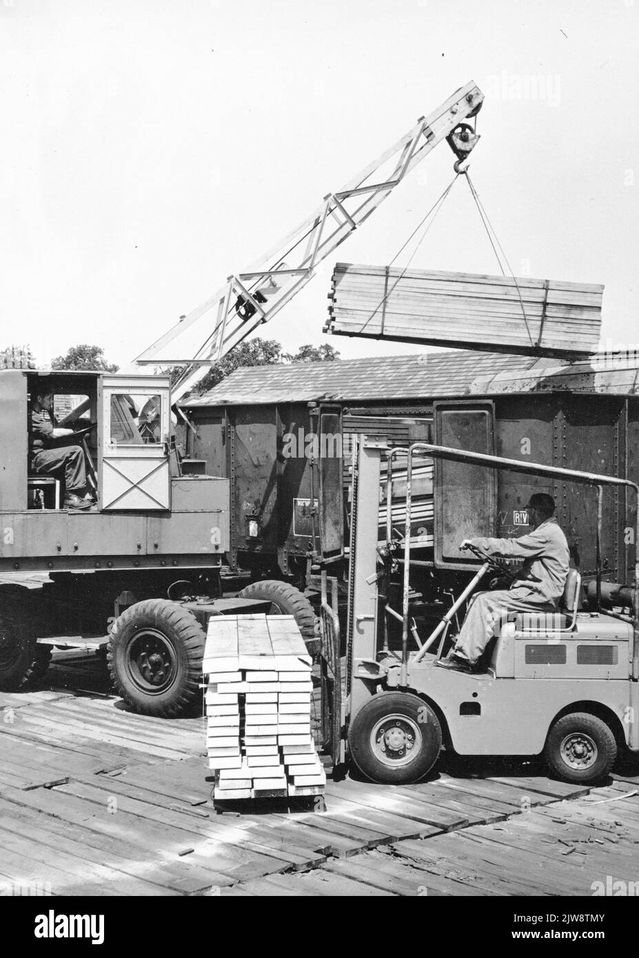 Image of loading an open freight wagon with wood in Amersfoort Stock ...