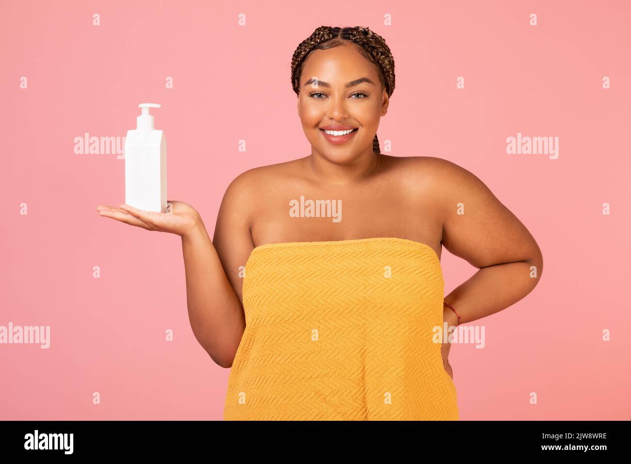 African American Lady Holding Dispenser Bottle Advertising Cosmetics ...