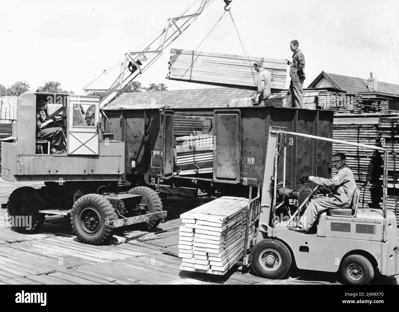 Image of loading an open freight wagon with wood in Amersfoort Stock ...