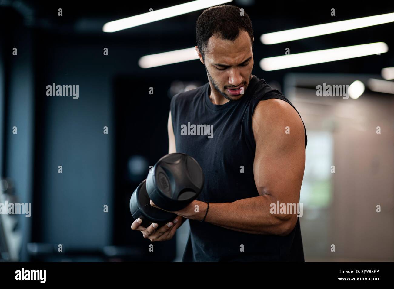 Biceps Workout. Young Black Muscular Guy Training With Dumbbell At Gym ...