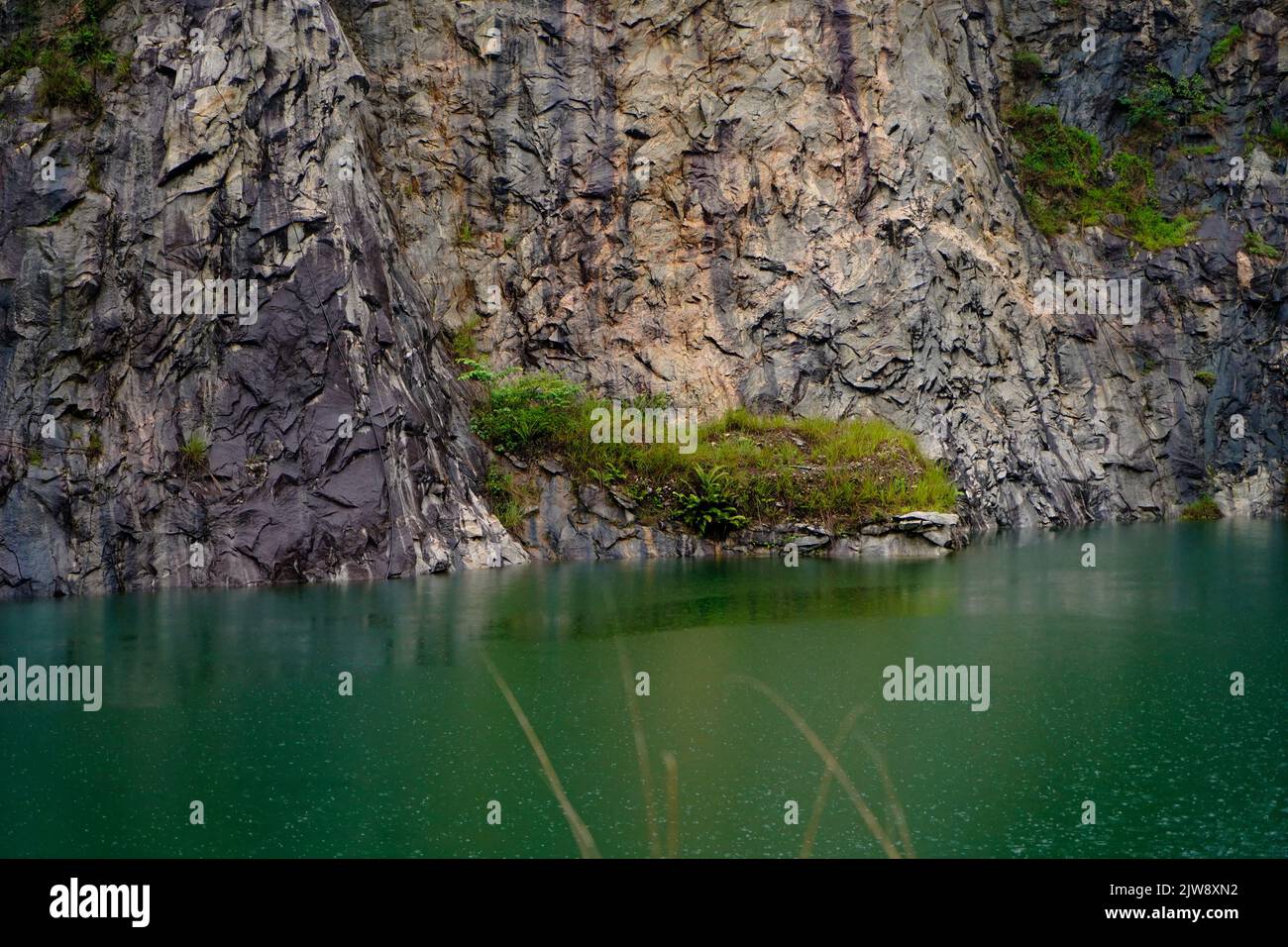 Pond formed in a given up quarry in Western Ghats Stock Photo - Alamy