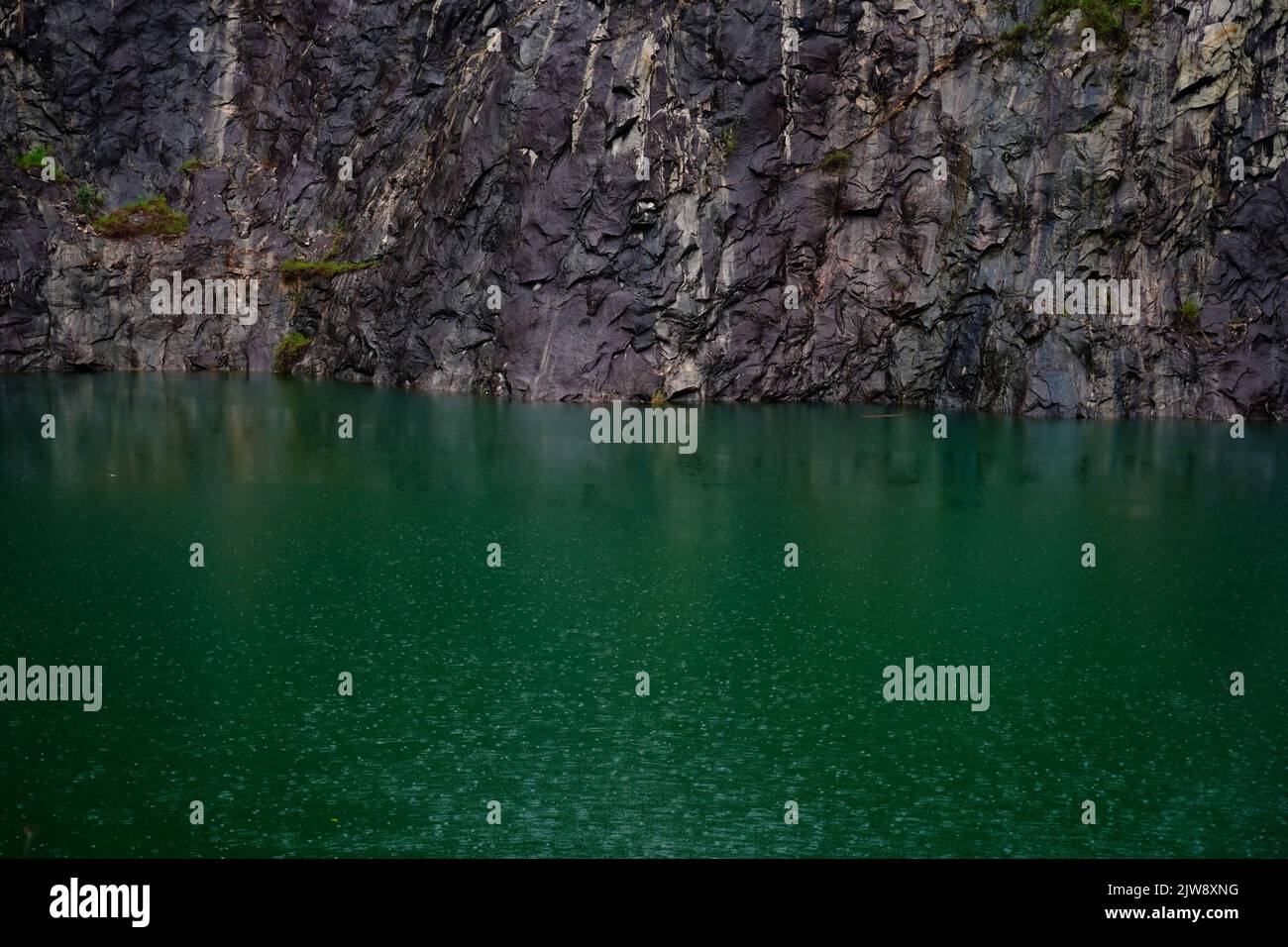 Pond formed in a given up quarry in Western Ghats Stock Photo - Alamy