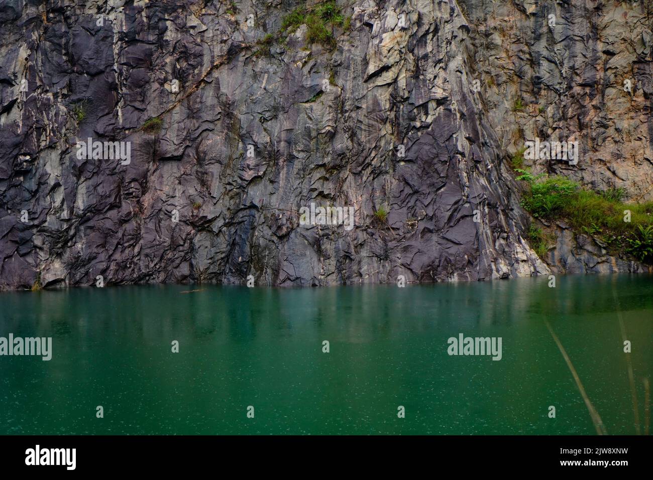 Pond formed in a given up quarry in Western Ghats Stock Photo - Alamy