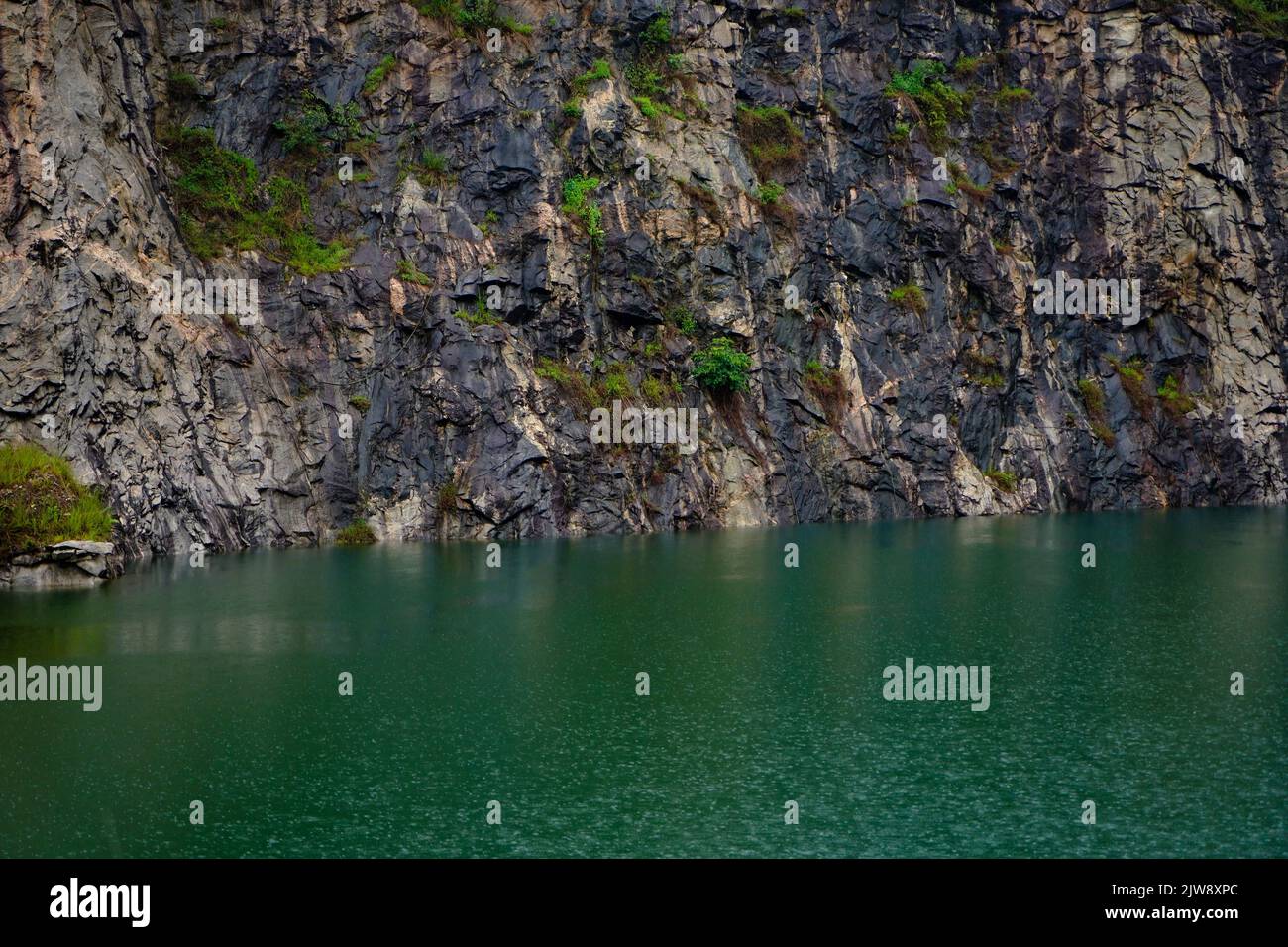 Pond formed in a given up quarry in Western Ghats Stock Photo - Alamy