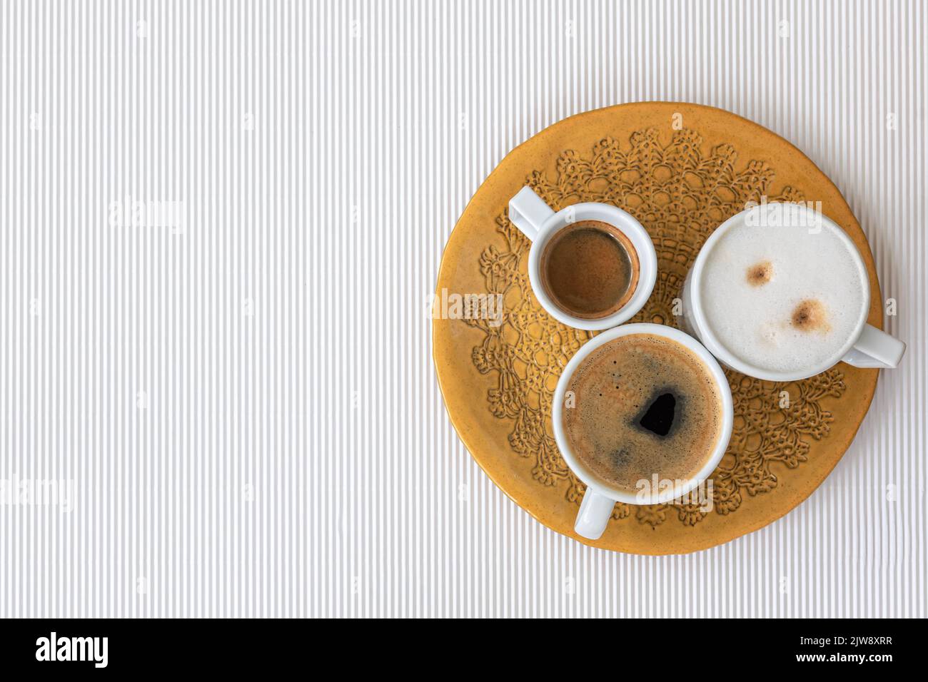 Three cups of coffee on a white texture background, flat lay Stock ...