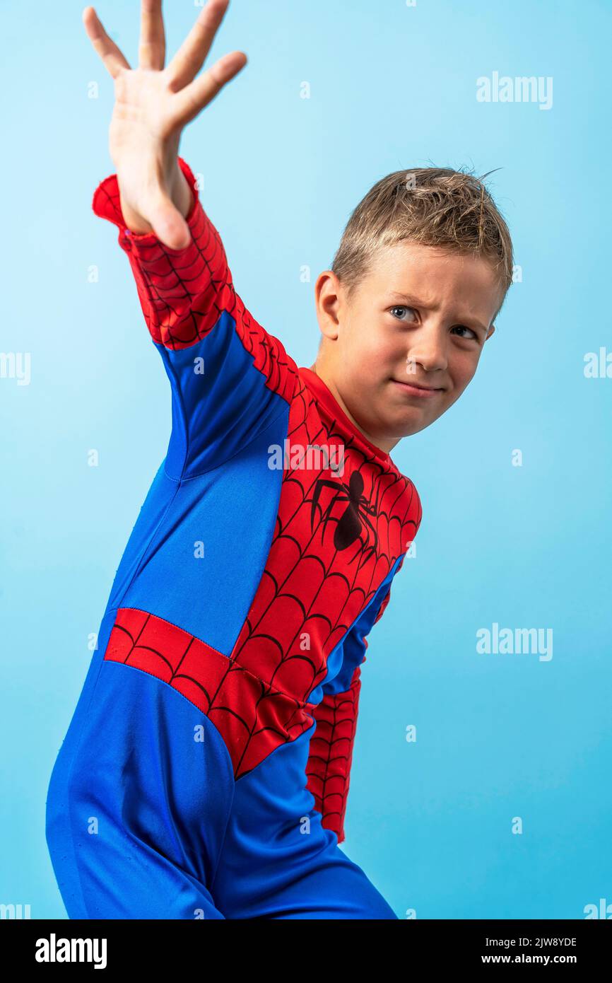 a boy in a hero costume. a victorious upward movement of the hand Stock ...