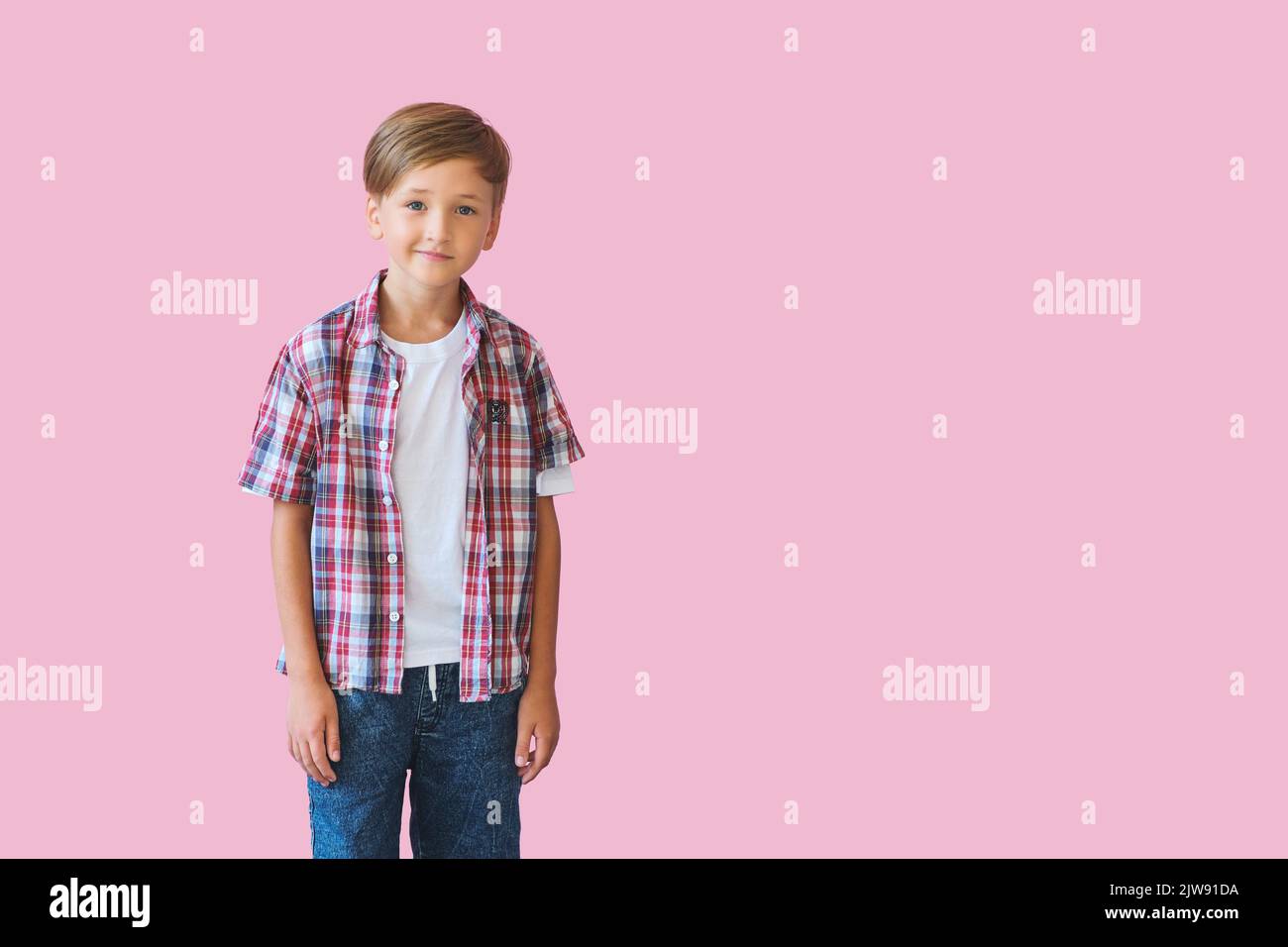 Young happy teen boy with in casuals on pink background Stock Photo - Alamy