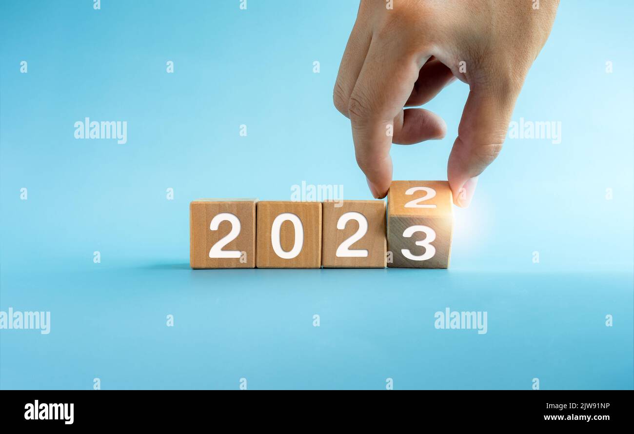 The calendar year 2022 changed to 2023, success concept. Wooden cube ...